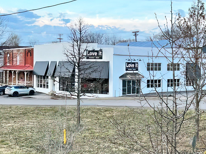 Love It stands ready across from historic downtown, a modern treasure chest disguised as a sleek white building.
