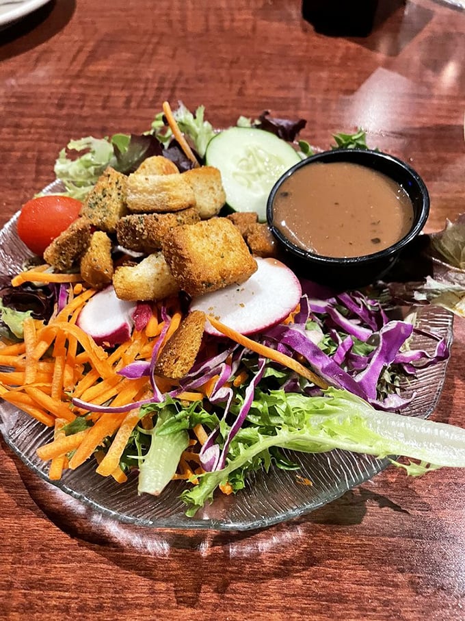 A garden salad that actually deserves the name "garden"&mdash;vibrant, fresh, and colorful enough to make you momentarily forget about those garlic mussels. Almost.