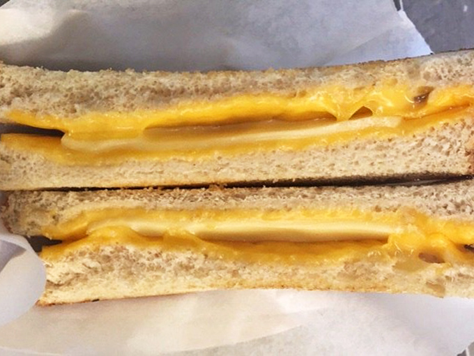 The humble grilled cheese—proof that sometimes the simplest combination of bread and melted cheese can outshine the fanciest restaurant creation.