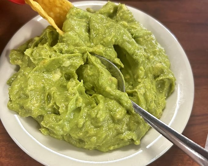 This guacamole deserves its own area code &ndash; creamy yet chunky, with just enough lime to make your taste buds do the cha-cha. The chip is merely a delivery system.