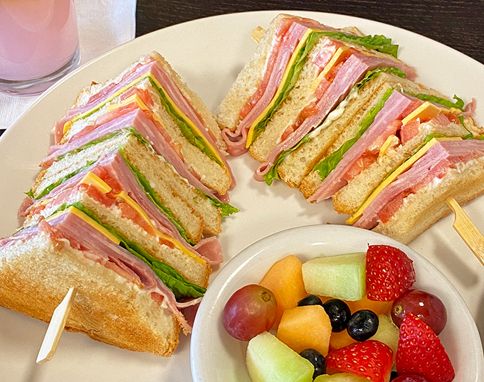 This club sandwich isn't playing games&mdash;layers of that famous ham stacked higher than your weekend plans. The fruit cup is just there for moral support.