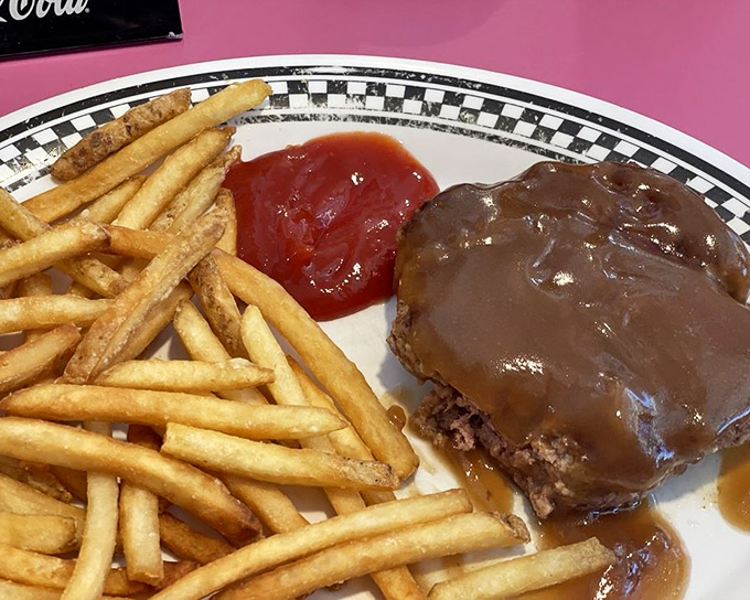 A hamburger steak smothered in gravy that whispers, "Diet starts tomorrow." This plate has comforted more Floridians than a perfect sunset.