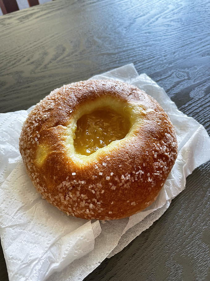 Behold the crown jewel &ndash; a sugar-crusted pastry with a golden center of fruit preserves that glistens like a stained glass window in a cathedral of carbs.