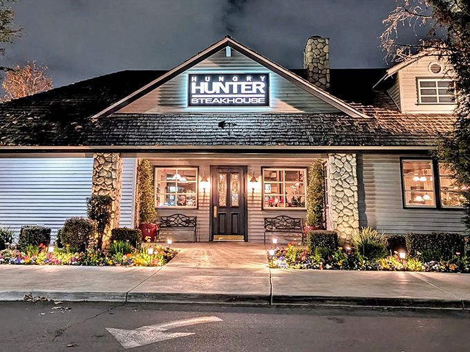 Hungry Hunter Steakhouse glows with warm invitation as evening falls. When the neon lights up, it's nature's way of saying "put down the microwave dinner."