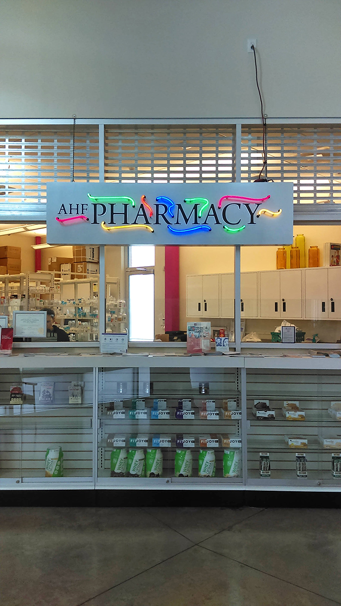 The on-site AHF Pharmacy provides convenient access to medications and healthcare services, reinforcing the store's commitment to community wellbeing beyond retail. 