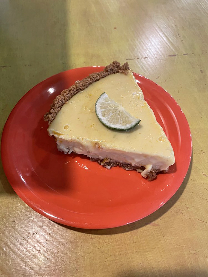 Key lime pie that captures Florida in a single bite. That graham cracker crust is holding sunshine and tanginess in perfect, creamy equilibrium.