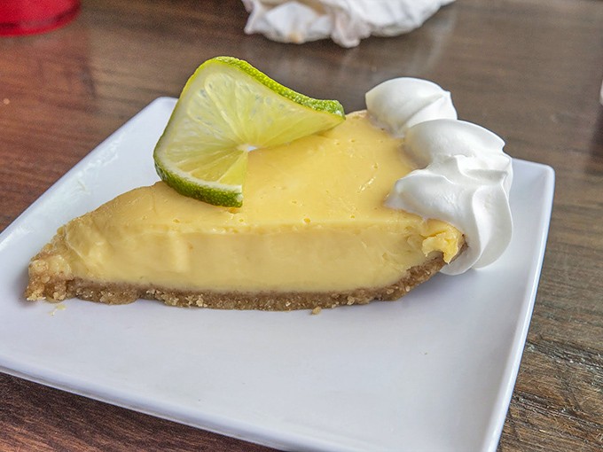 Key lime pie that makes you question why you've wasted time on other desserts. That dollop of whipped cream isn't optional&mdash;it's essential to the experience. 