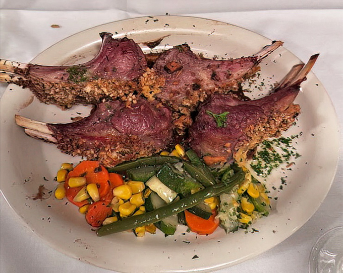 Lamb chops with a crust that should win architectural awards for both structure and flavor. The vegetable medley isn't a side &ndash; it's a worthy companion.