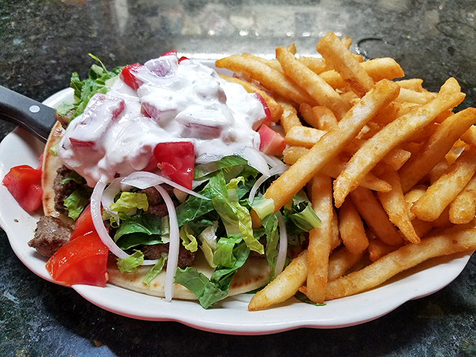 Lamb souvlaki showcasing the diverse menu that goes far beyond traditional diner fare.