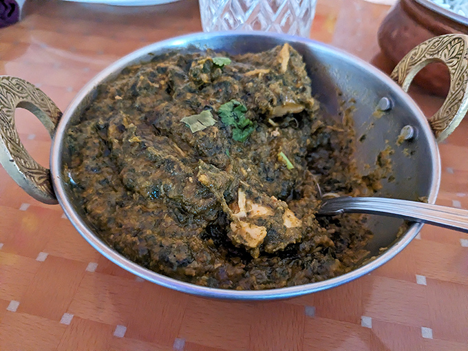Lamb saag isn't winning any beauty contests, but this spinach-rich stew delivers complex flavors that make you realize looks aren't everything in the food world.