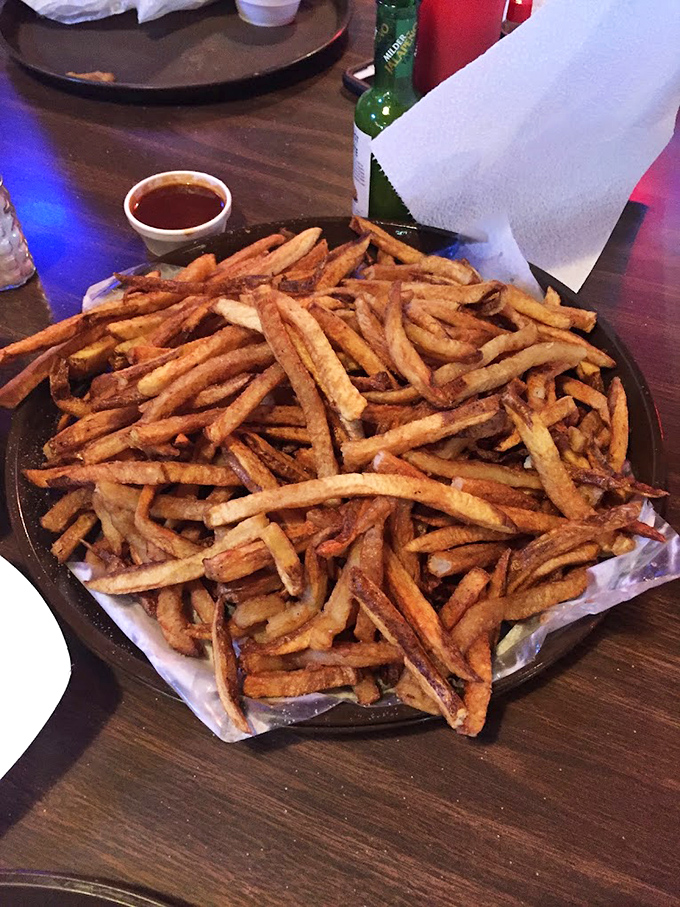 A mountain of hand-cut fries that makes you wonder why anyone would ever eat just a "serving" when you could have this glorious pile.