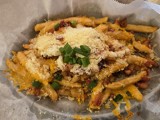 These aren't just loaded fries—they're a masterclass in excess done right. Cheese, bacon, green onions, and a sprinkle of parmesan for good measure.