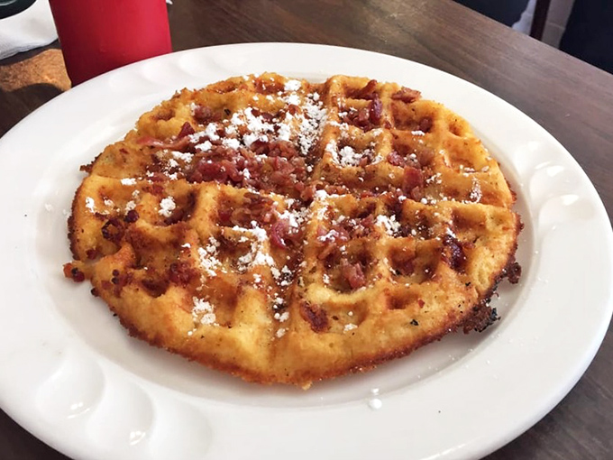 The waffle that answers the eternal question: "Is bacon a topping or a food group?" With a dusting of powdered sugar for that sweet-savory symphony.
