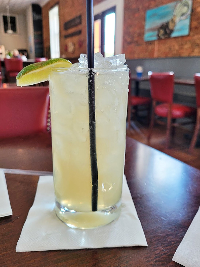 A margarita with a lime wedge perched on the rim&mdash;liquid sunshine in a glass that whispers, "Vacation starts now."