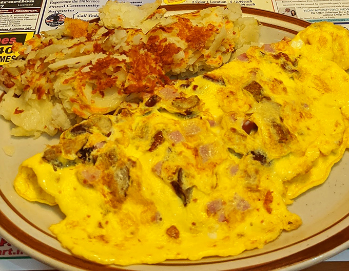 This omelet has more fillings than your average novel has plot twists, with home fries playing the perfect supporting role.