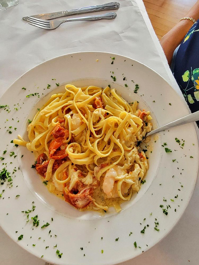 This seafood pasta isn't just a dish—it's a Mediterranean vacation on a plate, with perfectly cooked fettuccine embracing plump shrimp and lobster.