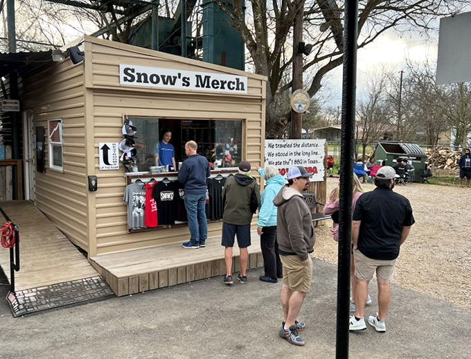 Snow's Merch stand, where the line forms for t-shirts and hats – proof you've completed your barbecue pilgrimage to this legendary spot.