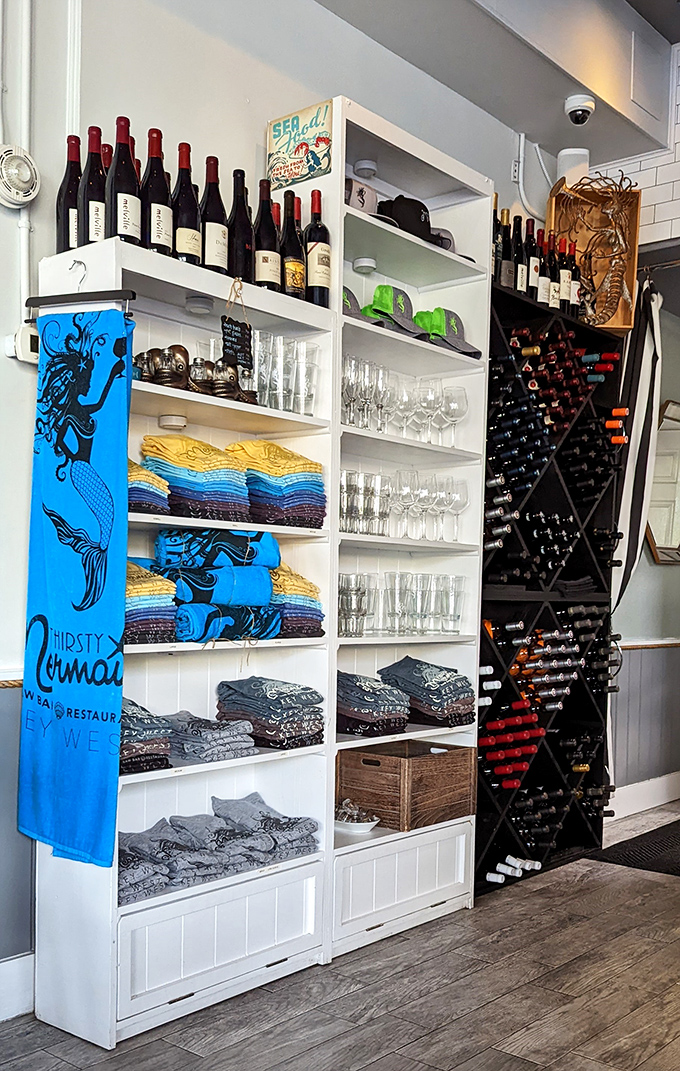 Merchandise that lets you take the mermaid home. Those bright blue towels are the souvenir that actually improves with age.