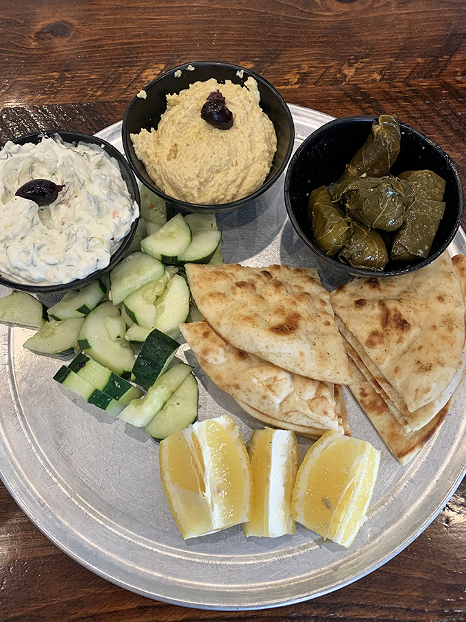 The meze sampler&mdash;for when you want a little bit of everything wonderful. Hummus, tzatziki, dolmades, and pita create a choose-your-own-adventure of flavors.