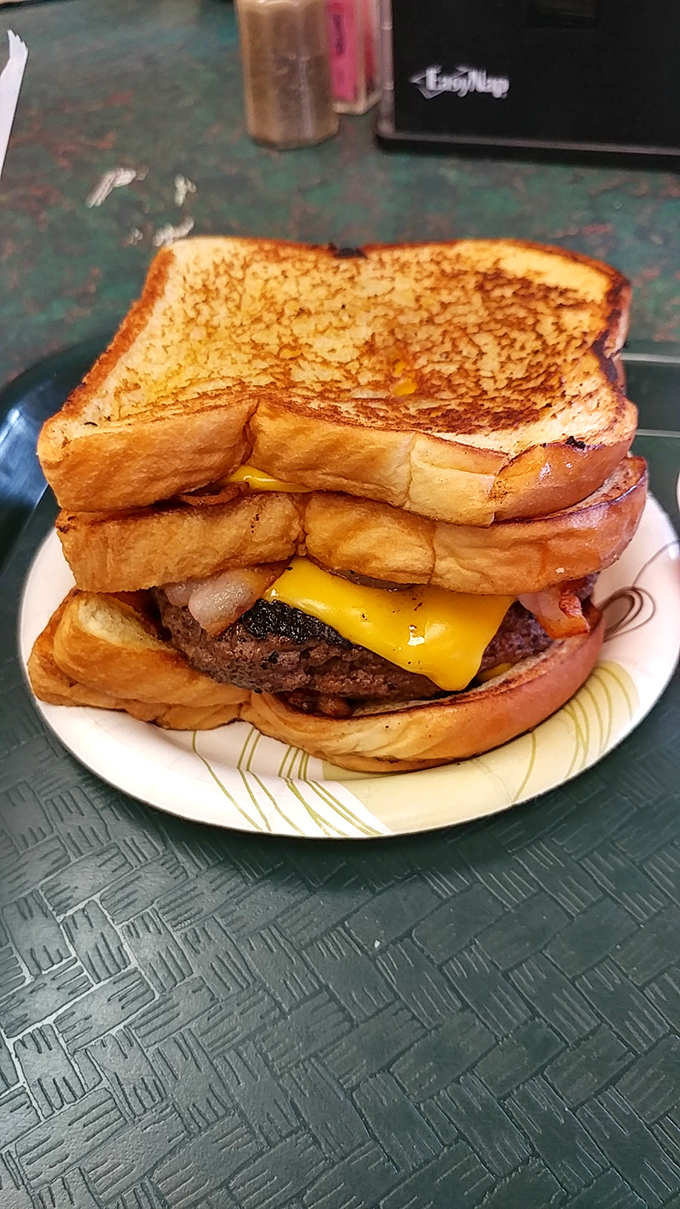 Texas toast elevates this burger from meal to monument. When your sandwich requires structural engineering, you know you're living right.