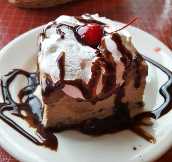A slice of mud pie that doesn't understand the concept of restraint&mdash;chocolate, cream, and a cherry on top that's purely ceremonial.