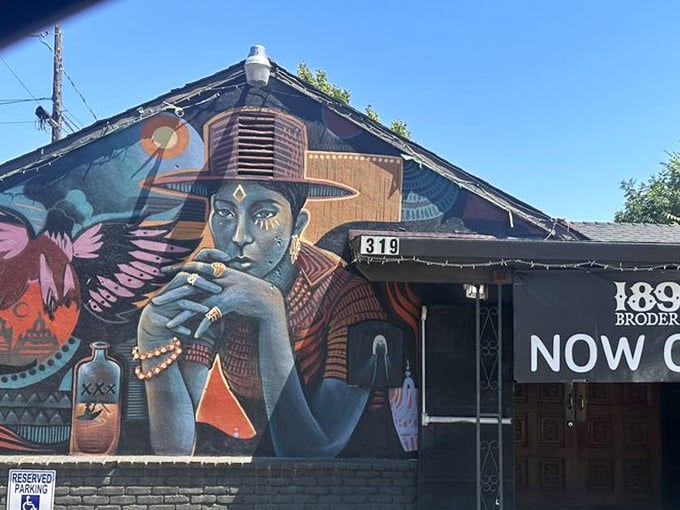 Street art meets street food at 319 Broderick. This mural doesn't just decorate&mdash;it announces that ordinary burgers need not apply.