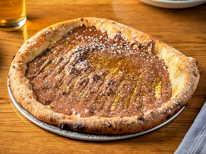 Dessert pizza that answers the eternal question: "What if Nutella had a passionate affair with perfect dough?" Sweet dreams are made of this.