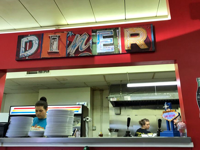 The word "DINER" in lights &ndash; because sometimes you need your breakfast with a side of theatrical flair.