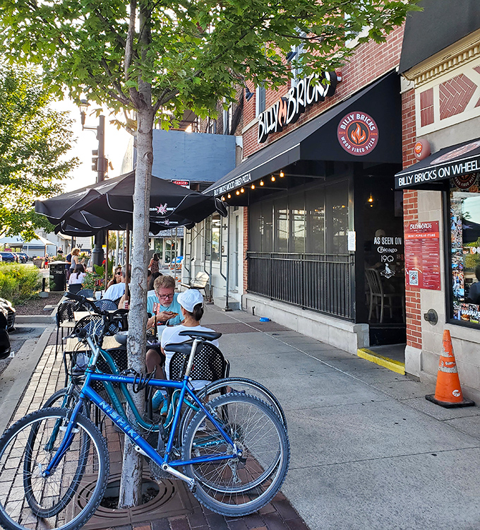 The exterior view that locals recognize as their neighborhood pizza sanctuary&mdash;where bicycles parked outside signal good decisions being made within.