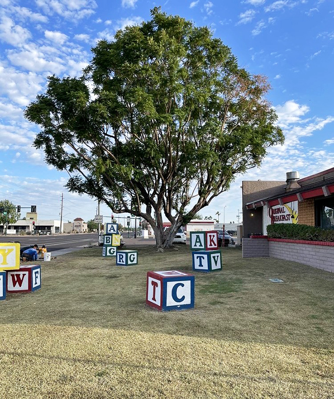 Giant alphabet blocks scattered across the lawn&mdash;a playful reminder that breakfast joy is elementary at Original Breakfast House.