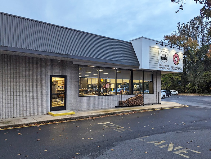 Dawn or dusk, this welcoming storefront beckons hungry travelers like a lighthouse guiding ships to safe harbor. The promise of donuts is a powerful navigational tool.