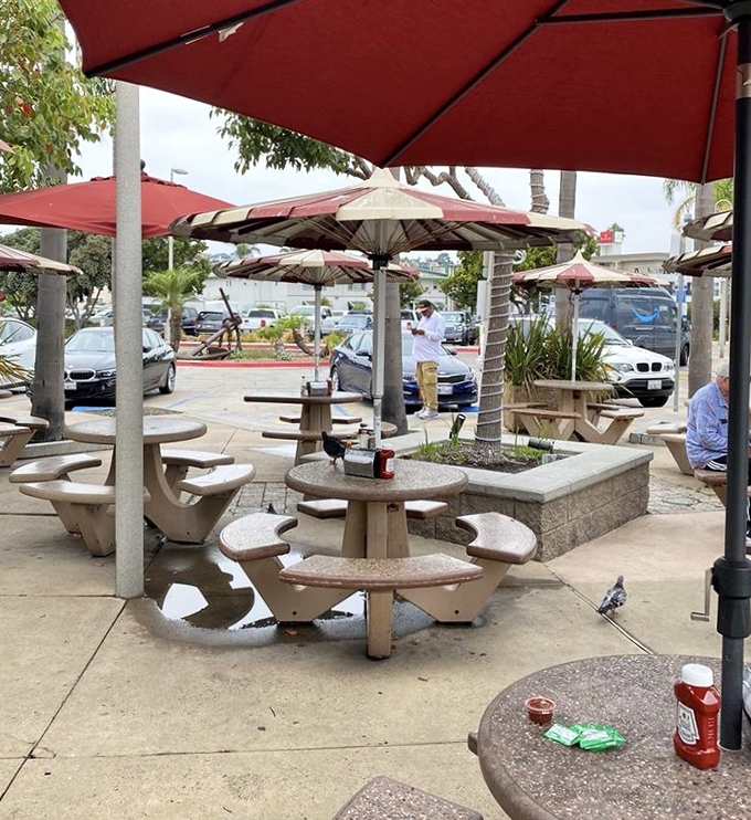 Outdoor seating where sea breezes enhance every bite. These umbrella-shaded tables are prime real estate for seafood feasting.