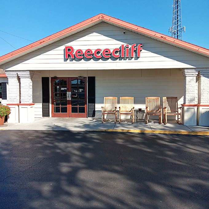 The Reececliff sign glows like a beacon of hope for hungry travelers. Those wooden rocking chairs invite you to digest awhile after pie indulgence.