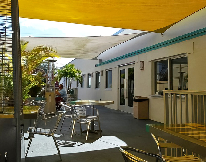 The outdoor patio&mdash;where the Florida breeze mingles with burger steam to create the perfect atmospheric conditions for serious eating.