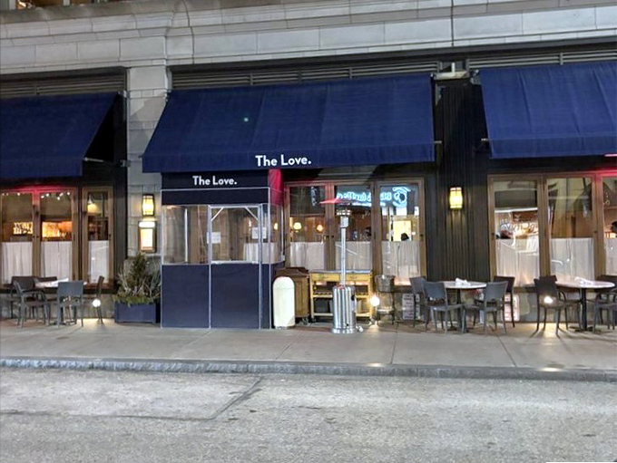 Even at night, those blue awnings glow with invitation. Dinner at The Love feels like being let in on Philadelphia's best-kept secret.