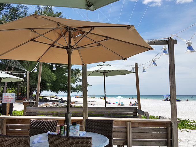 Umbrella-shaded tables with front-row seats to paradise. Some views are worth traveling 1,000 miles for.