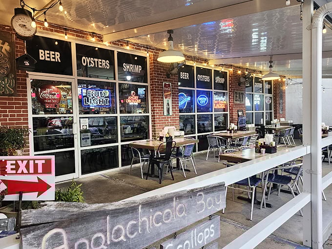 Outdoor seating where the Florida breeze carries conversations between strangers who become friends over shared oyster platters.