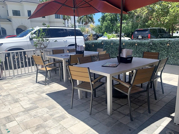 Florida dining at its finest&mdash;outdoor tables under umbrellas where the gentle breeze complements your burger experience perfectly.