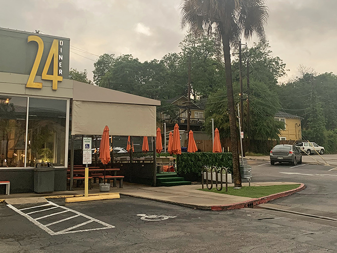 The outdoor patio waits under palm trees and orange umbrellas&mdash;a perfect spot for people-watching with your chicken and waffles.