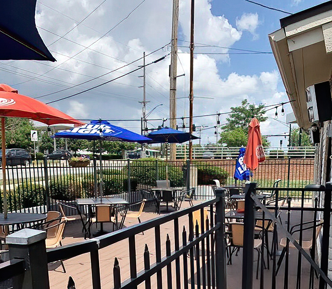 The patio's simple charm invites you to enjoy your pizza beneath blue skies and beer umbrellas&mdash;because pasta tastes even better with a side of fresh air.