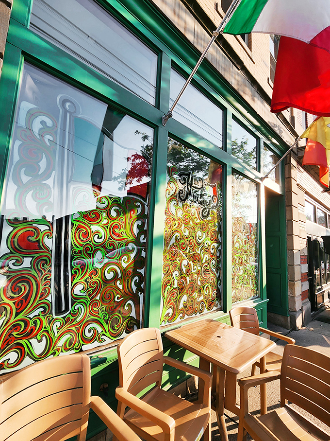 Those colorful swirled window designs are like a psychedelic preview of the flavor explosions waiting inside. The outdoor seating area invites you to savor your treats immediately.