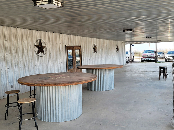 Outdoor seating with rustic charm&mdash;cable spool tables and metal stars announce "You're in Texas" before you take your first bite.