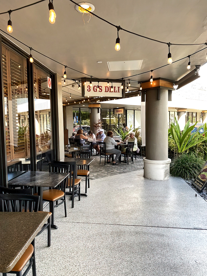 Outdoor seating under string lights creates the perfect Florida dining atmosphere. All the New York deli flavor with a side of sunshine.