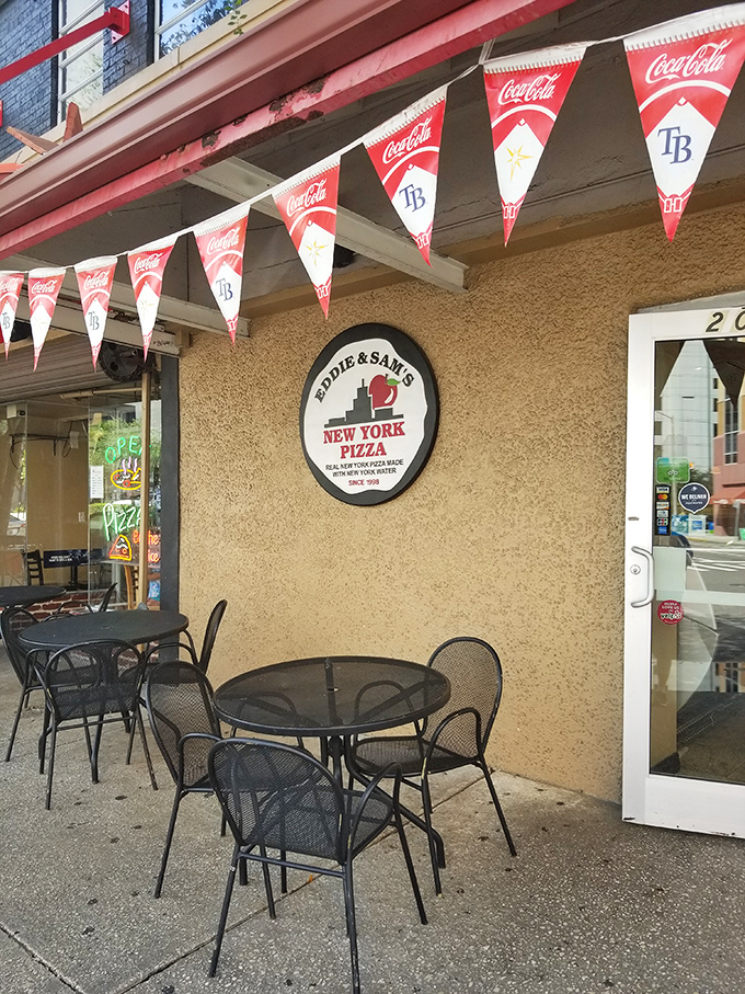 Outdoor seating for those rare Florida days when the humidity takes a vacation. Pizza tastes 10% better with a side of people-watching.
