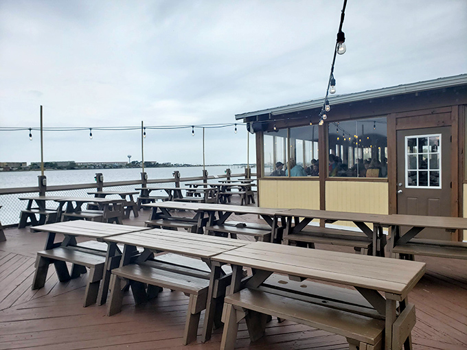 Empty tables waiting for the lunch rush like actors before curtain call. Soon they'll host the daily seafood symphony.