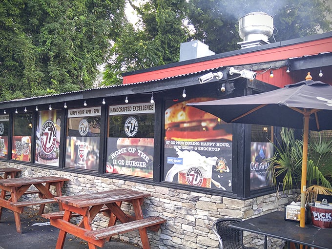 The outdoor seating area offers a perfect perch for people-watching while debating which of the 77 burgers to try next time.