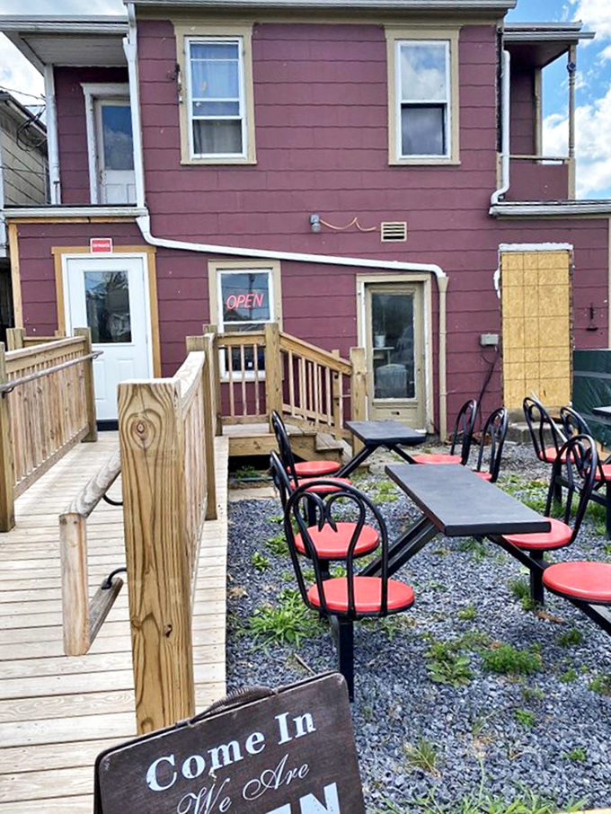 Outdoor seating where the aroma of smoking meats mingles with fresh air&mdash;nature's perfect dining companion.