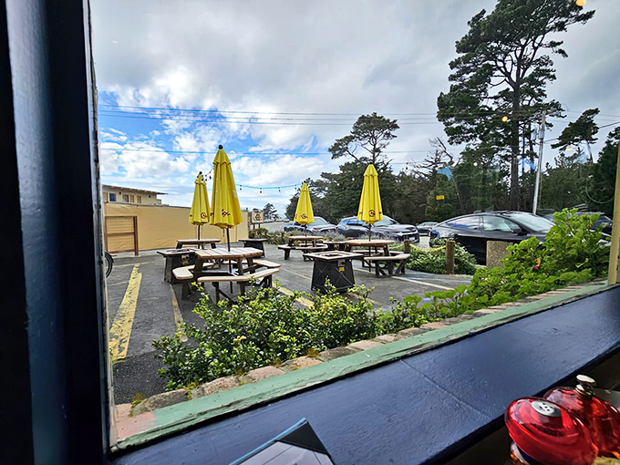 The view from inside reveals outdoor seating where Pacific Grove's coastal charm becomes part of your dining experience.