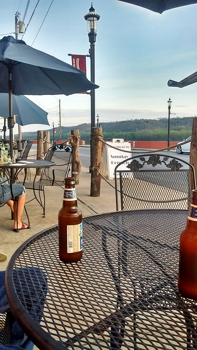 The view that turns a simple beer into a moment of reflection. The Ohio River flows by as conversations meander just as freely.