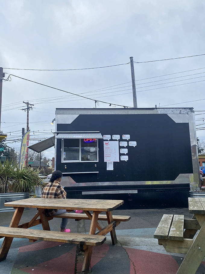 Even the outdoor seating has character. This food truck setup proves great chicken doesn't need fancy surroundings to shine.